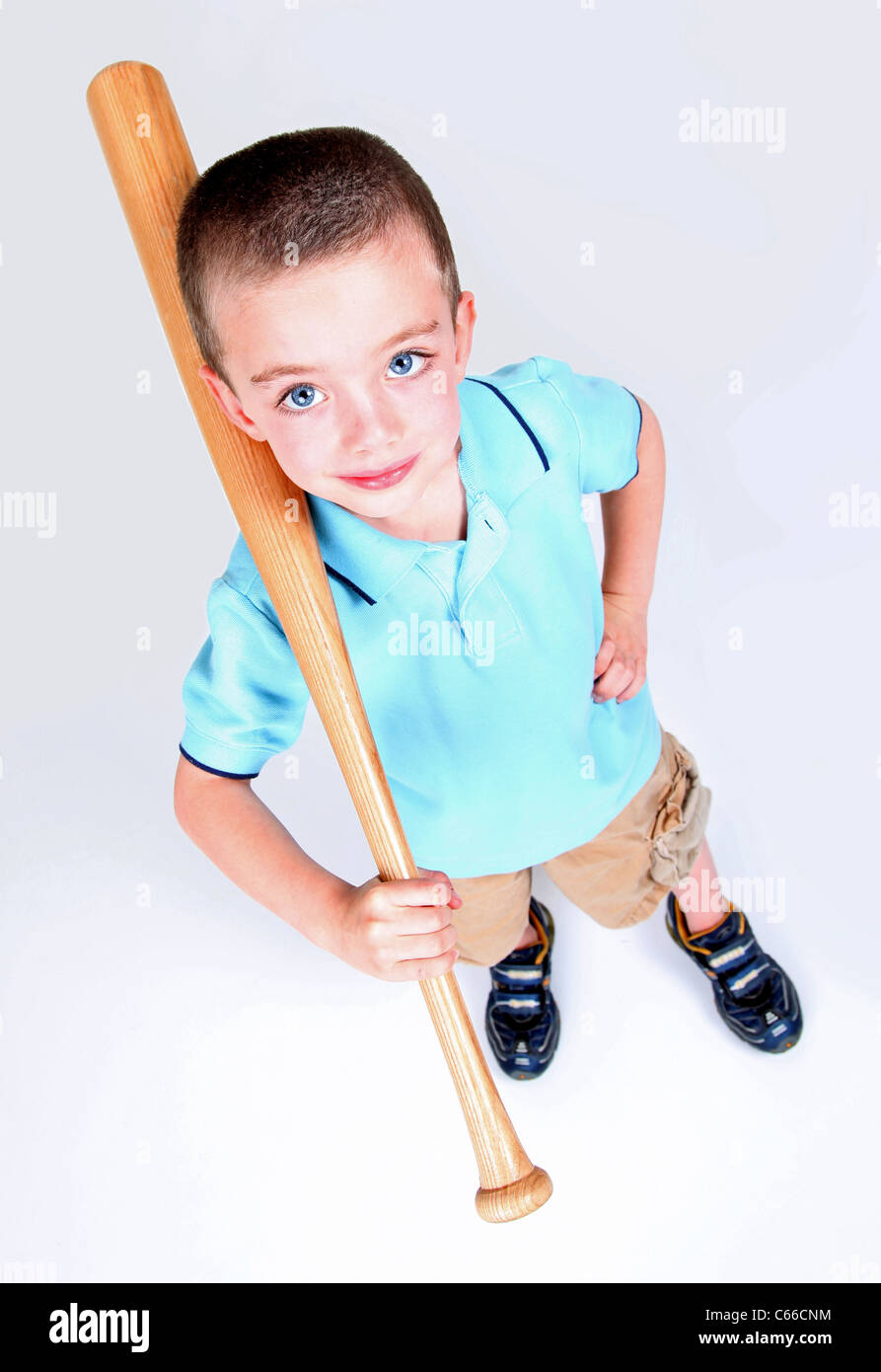 Young boy holding a baseball bat with attitude Stock Photo - Alamy