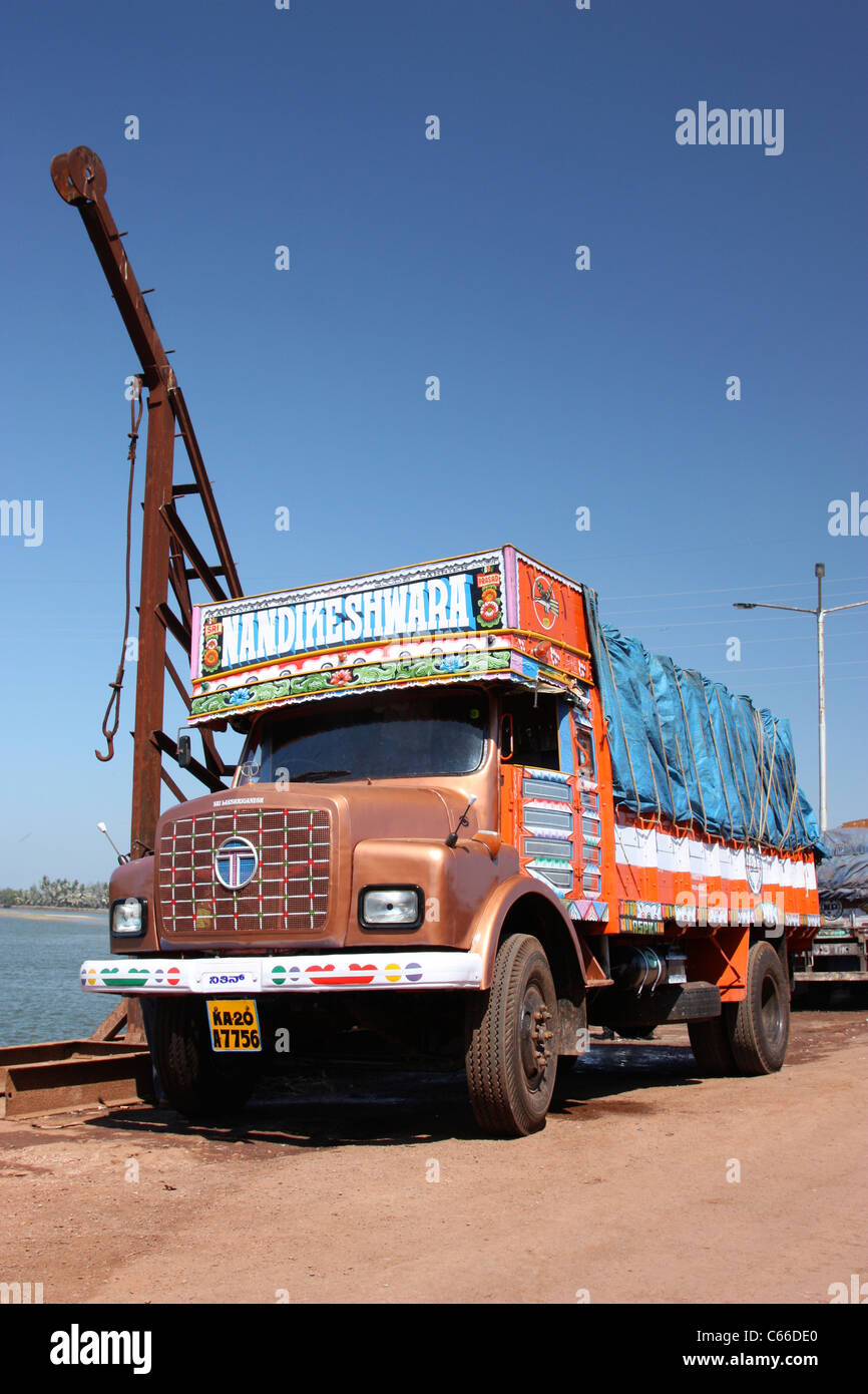 Fish trucks at sunset on the quayside awaiting loading Goa India Stock ...