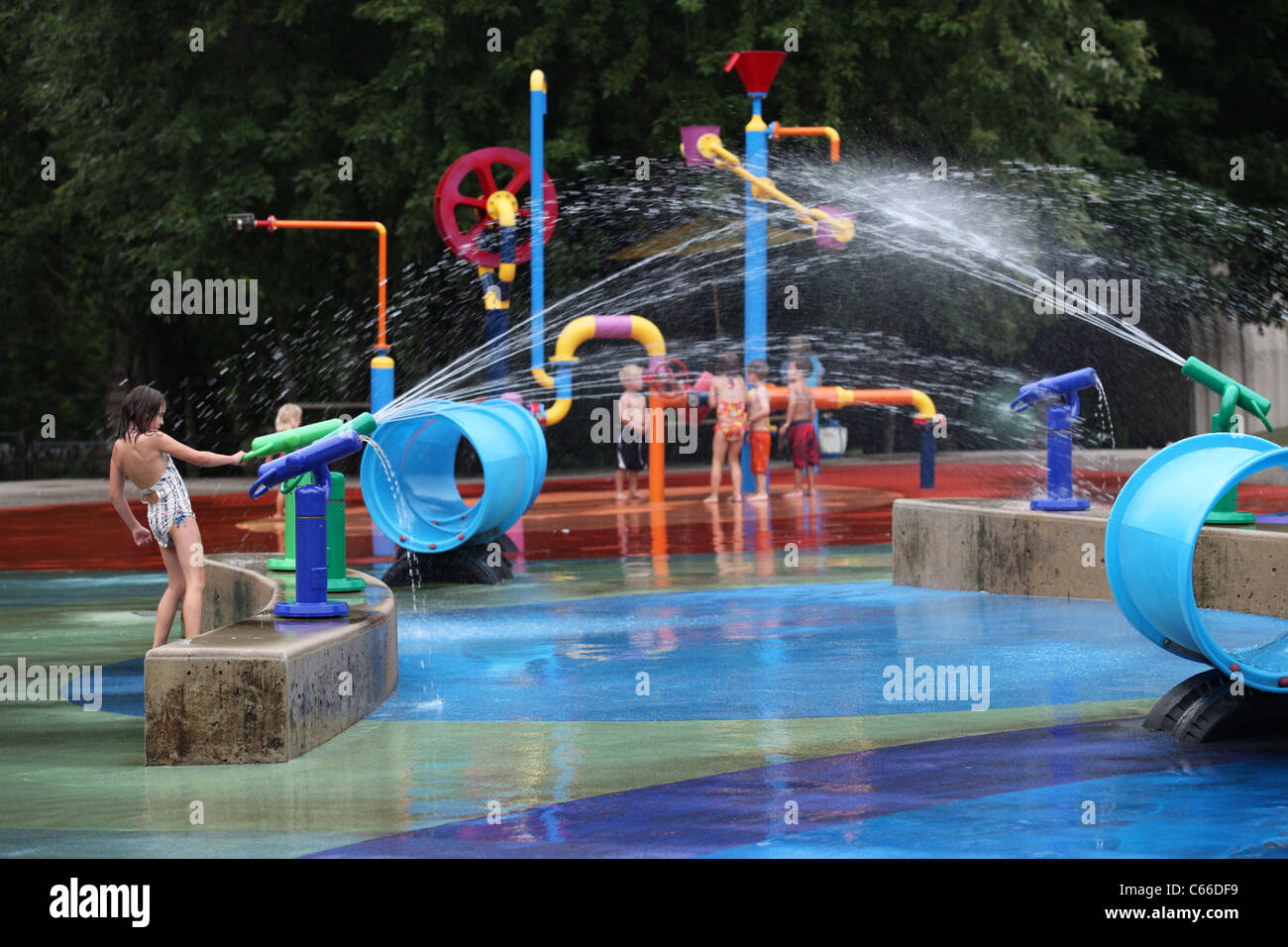 Children shooting water gun at each other at water park Stony Brook in ...