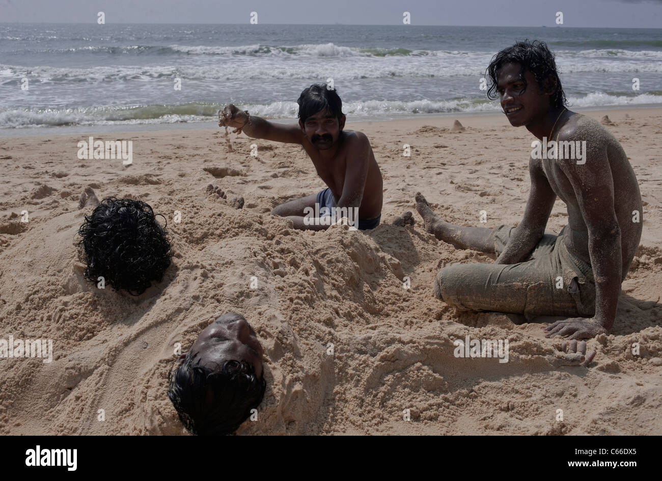 Sand bath at Penambur Beach Mangalore-Karnataka-India Stock Photo - Alamy