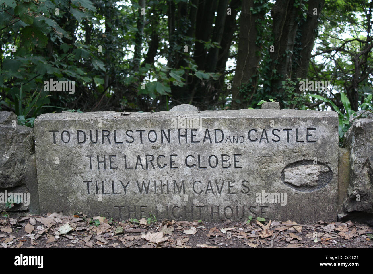 Old stone sign set in dry stone wall. Swanage Durlson Country Park ...
