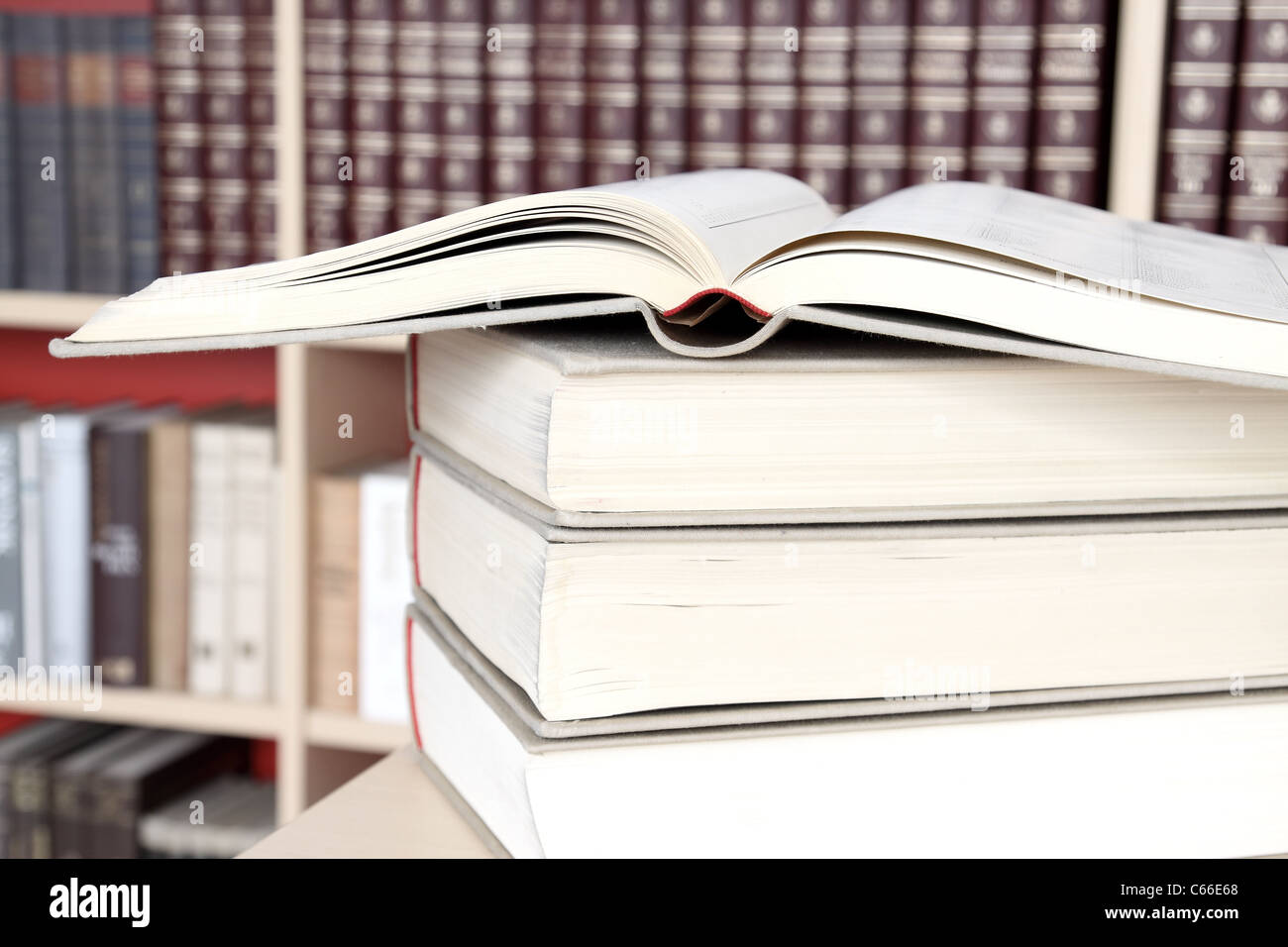 Open book in the library Stock Photo - Alamy