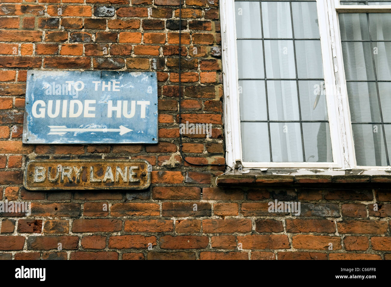 old road sign to the Guide Hut on the side of a building in Chesham old ...