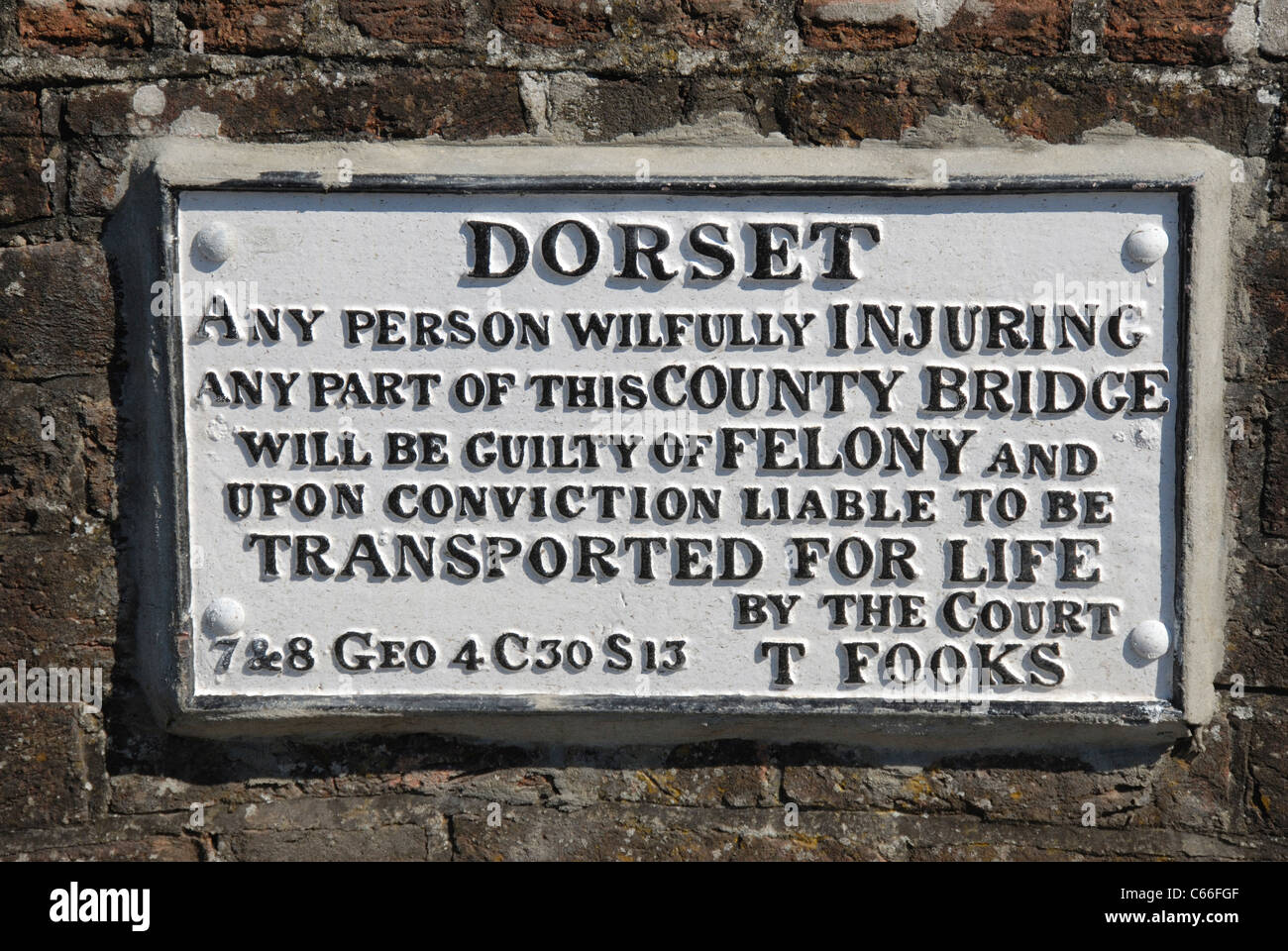 A cautionary sign warning people of deportation if they damage the ...