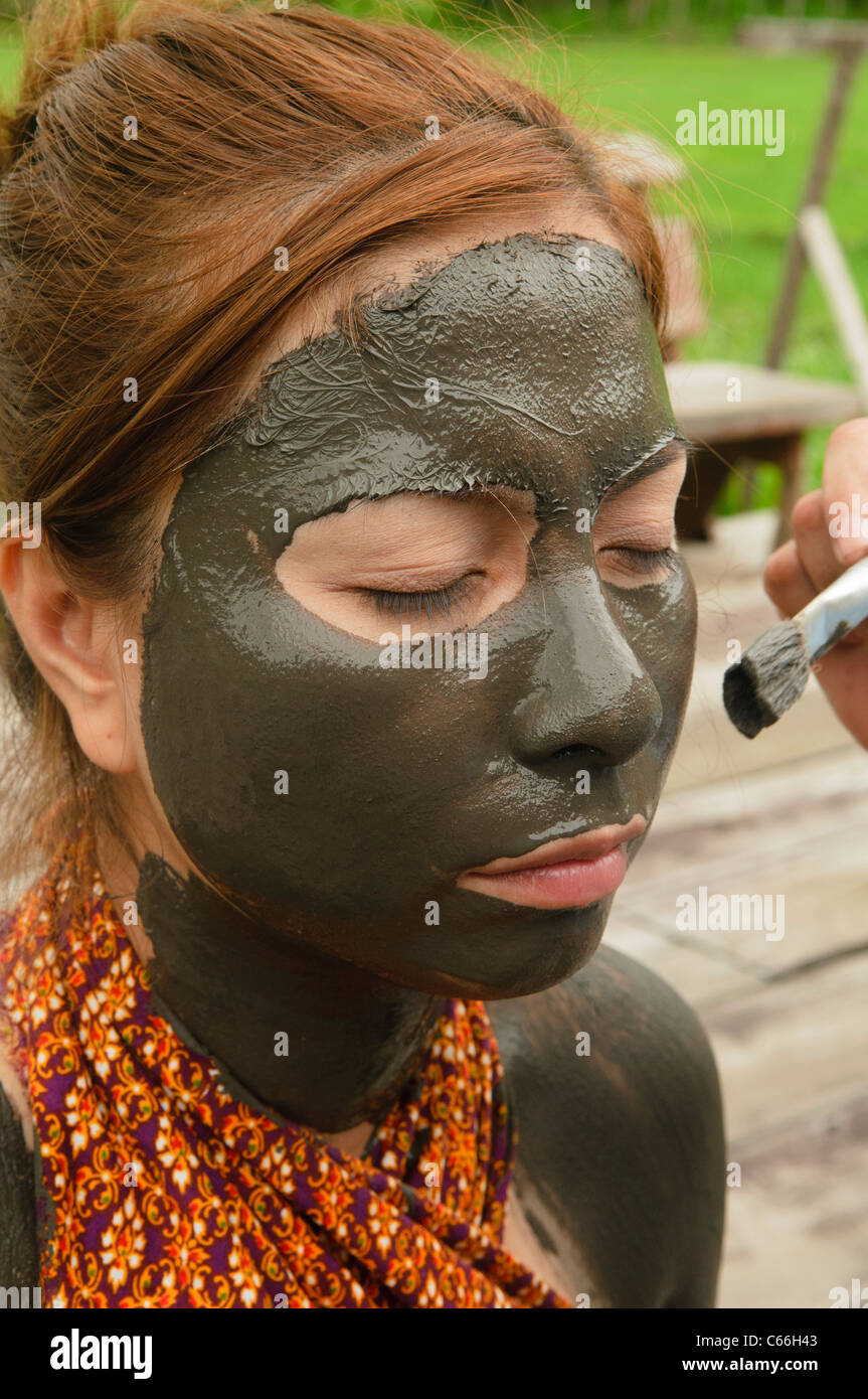 Thai woman enjoying a therapeutic mud treatment at the Phu Klon Mud Spa ...