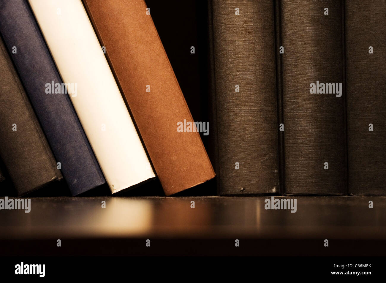 a close up shot of book on shelf, indoor setting Stock Photo - Alamy