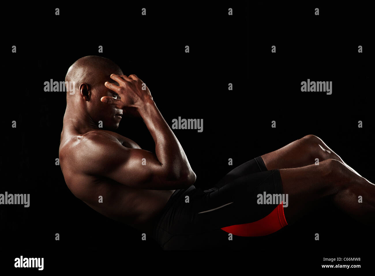 Athlete doing sit-ups Stock Photo - Alamy