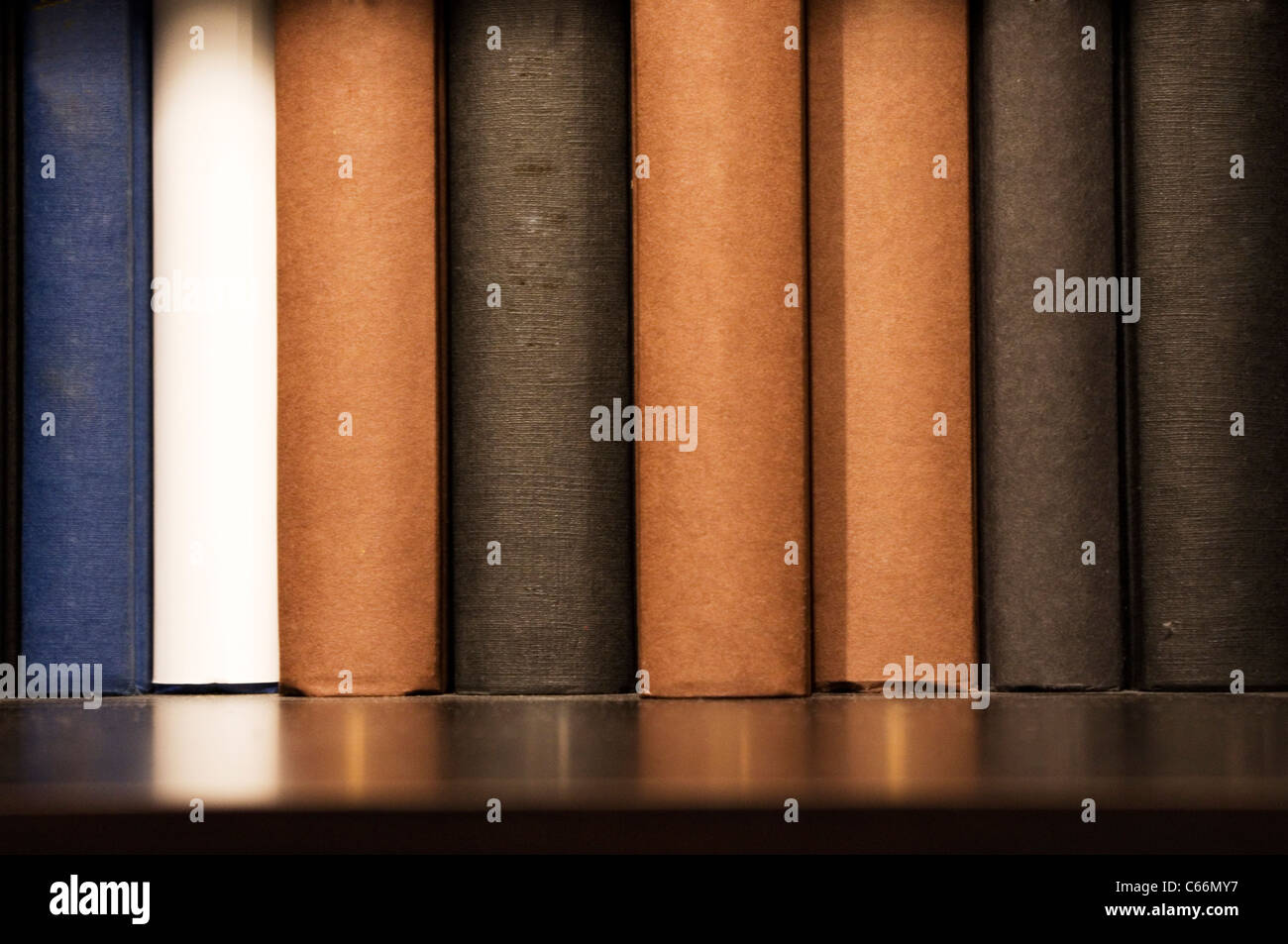 a close up shot of book on shelf, indoor setting Stock Photo - Alamy