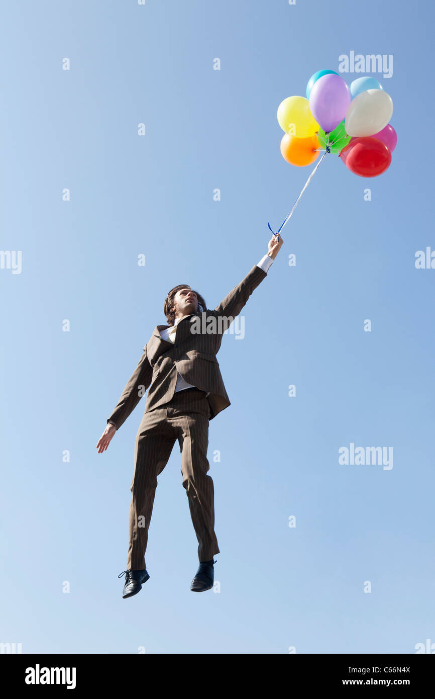 Balloons Floating Man High Resolution Stock Photography and Images - Alamy