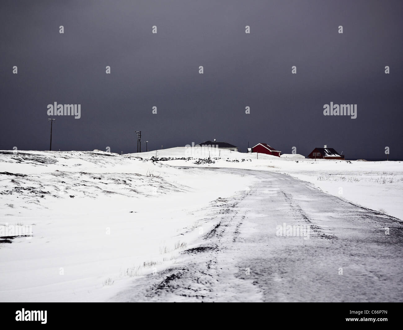 Houses on snowy rural road Stock Photo - Alamy
