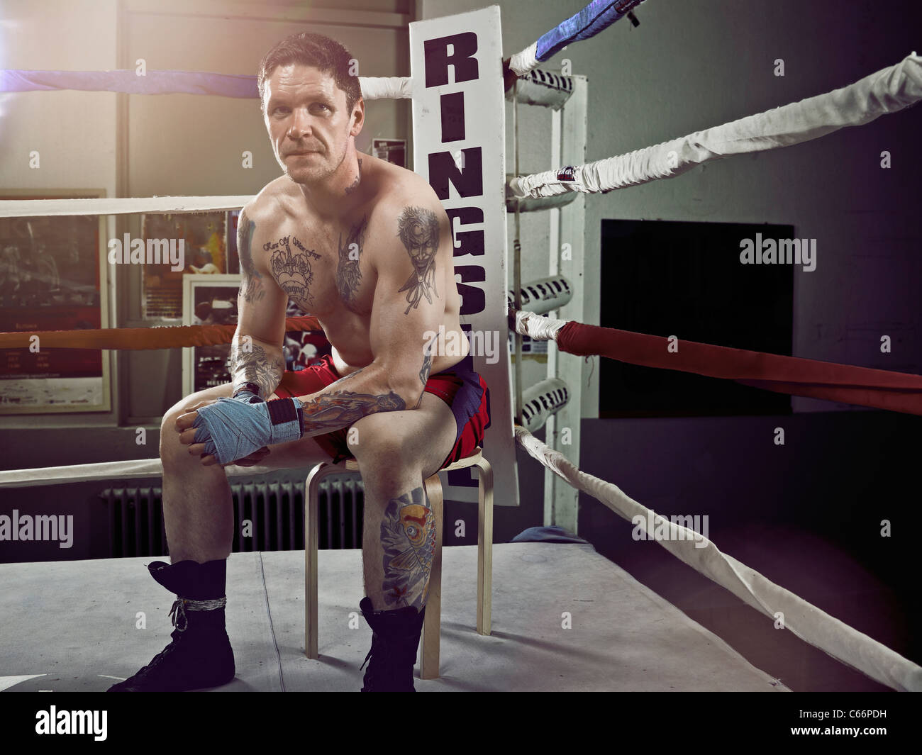 Boxer sitting in corner of ring Stock Photo - Alamy