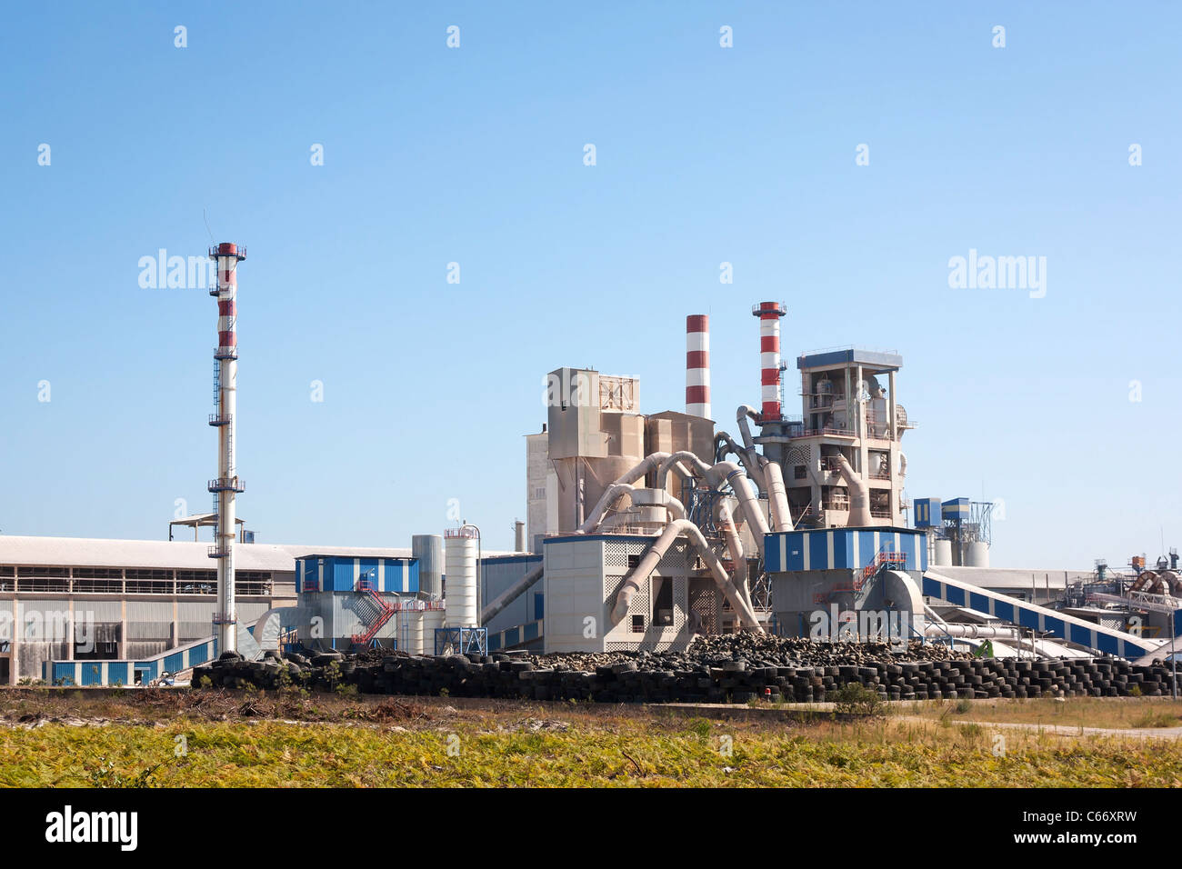 Rubber factory integrated into the landscape against blue sky Stock ...