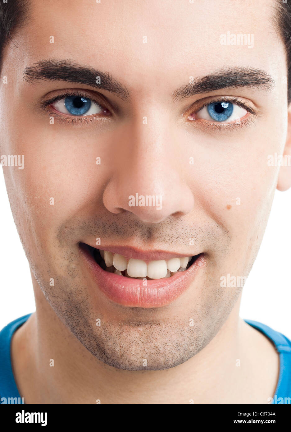 Close-up portrait of handsome young man with blue eyes Stock Photo - Alamy