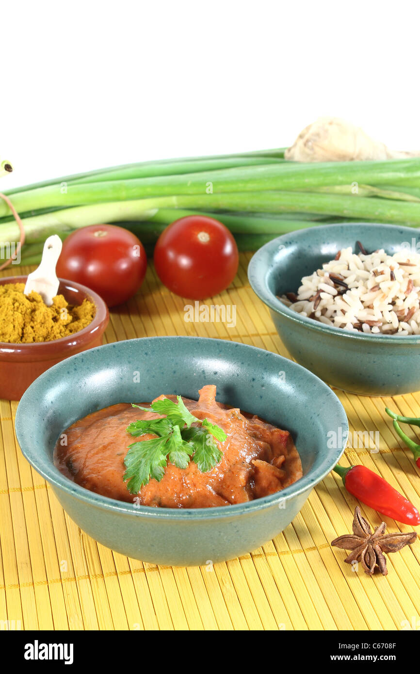 Indian red Curry with wild rice, chilli and bamboo shoots Stock Photo ...