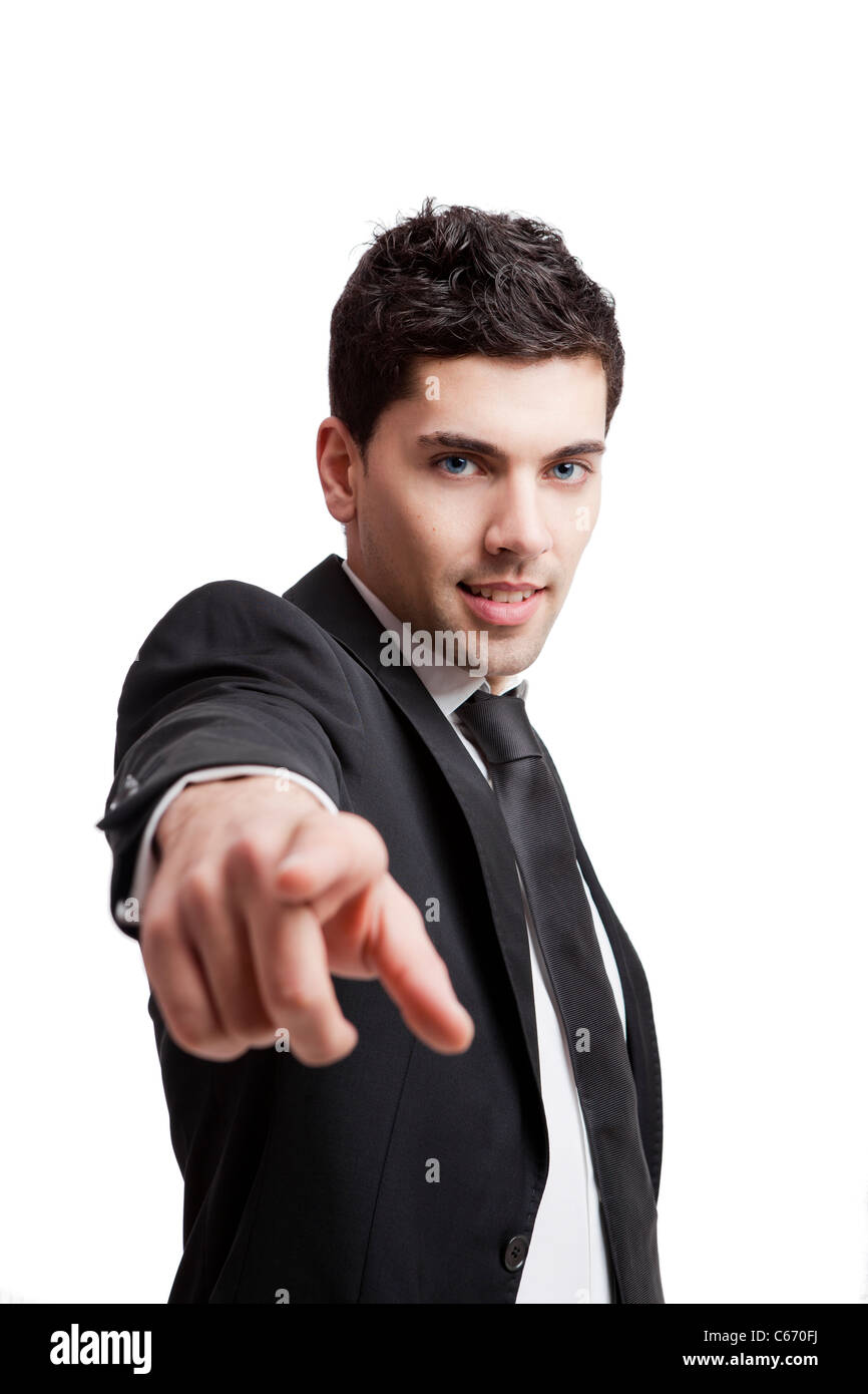 Young businessman pointing to you, isolated over a white background ...