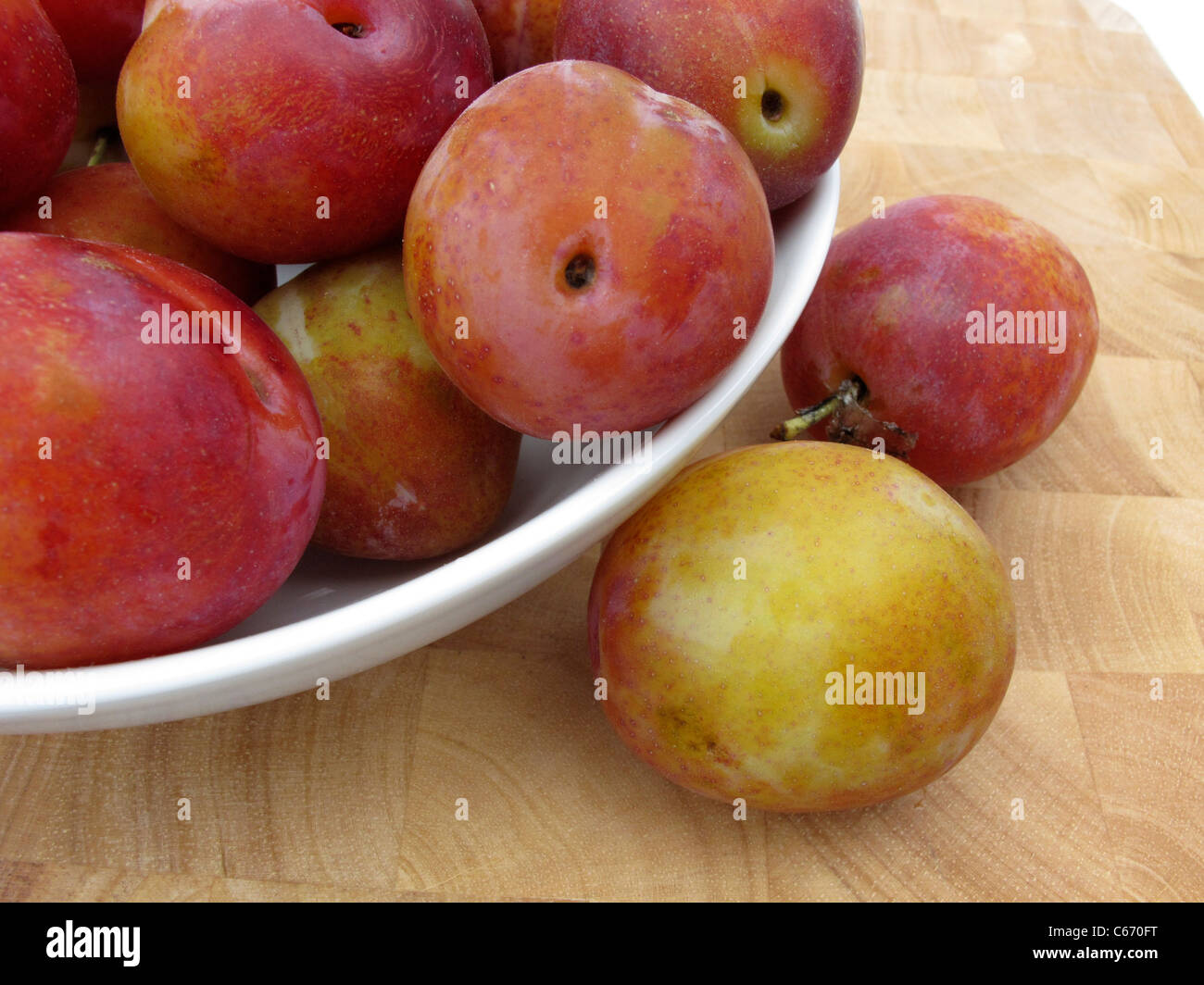 Victoria Plums in a White Bowl Stock Photo - Alamy