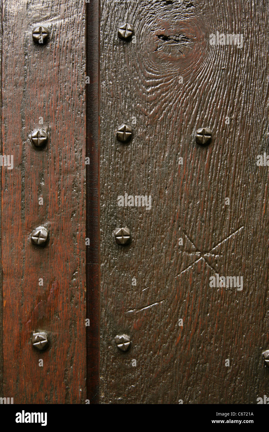 Detail of old handmade screws in timber pannelling Stock Photo - Alamy