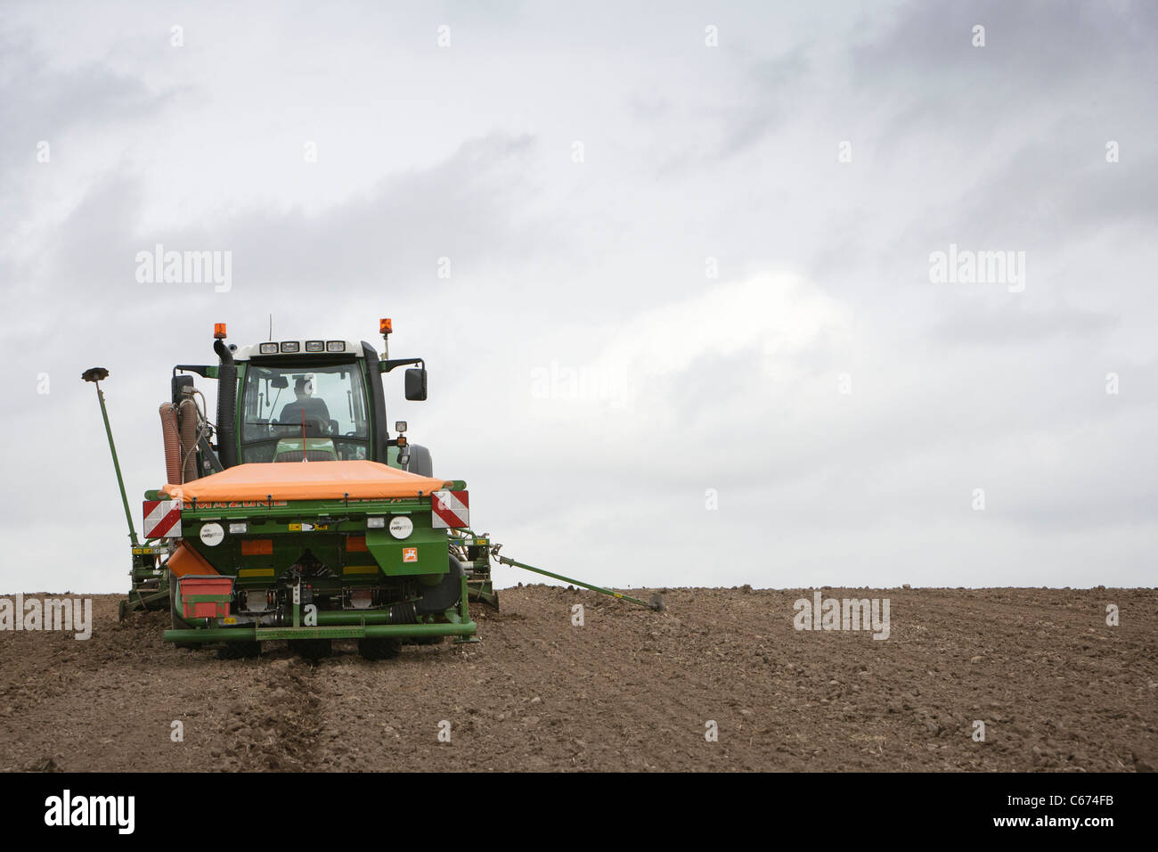 A Fendt tractor tilling a field in Scotland Stock Photo - Alamy
