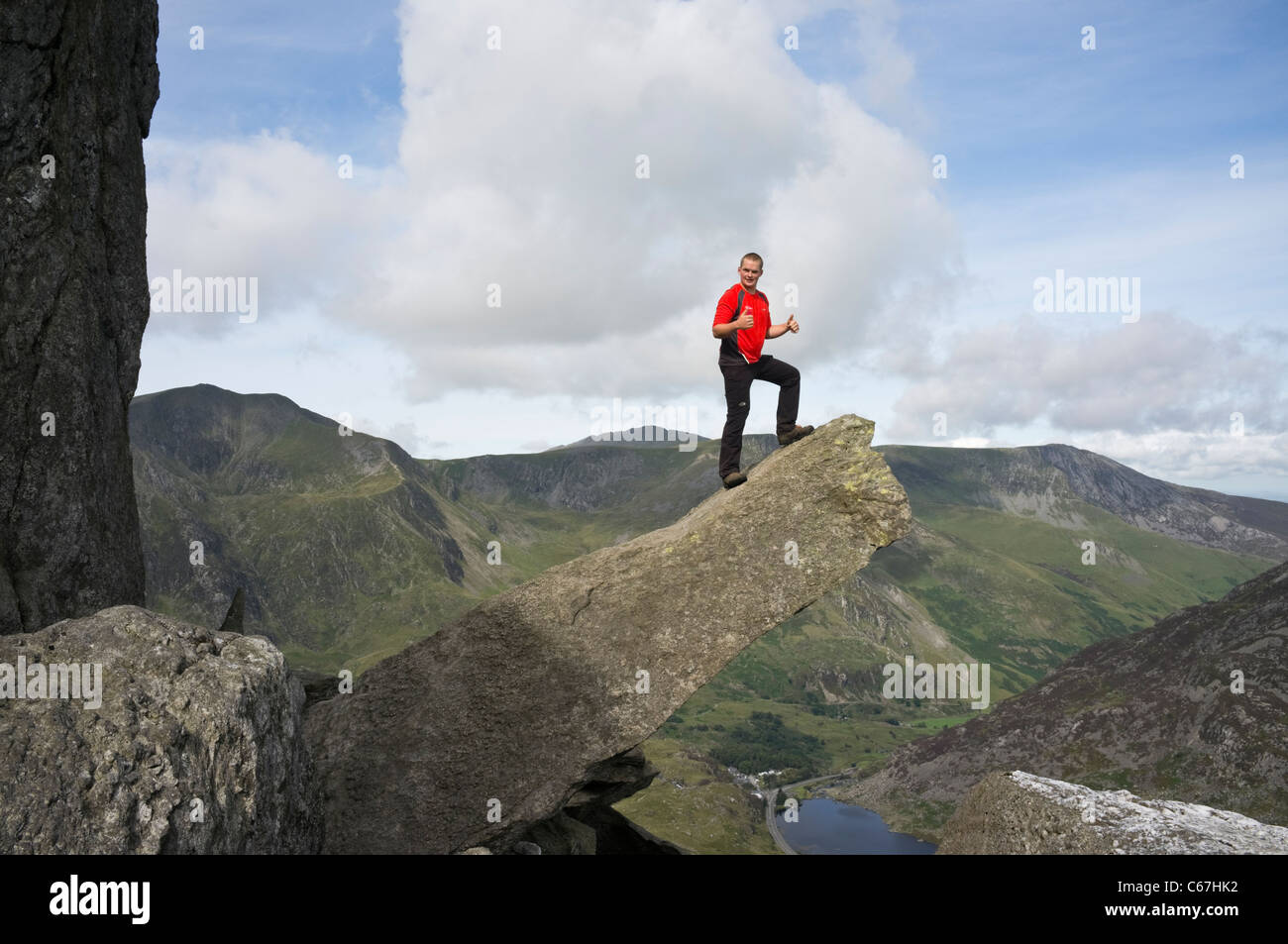 Man successfully standing on the cannon rock on north ridge of Mount ...