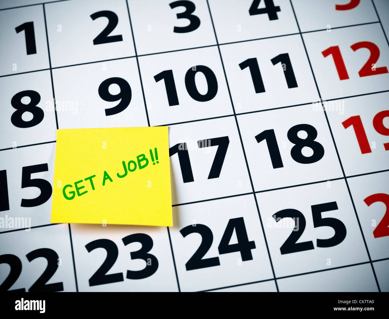 Get a job written on a sticky note on a calendar Stock Photo - Alamy
