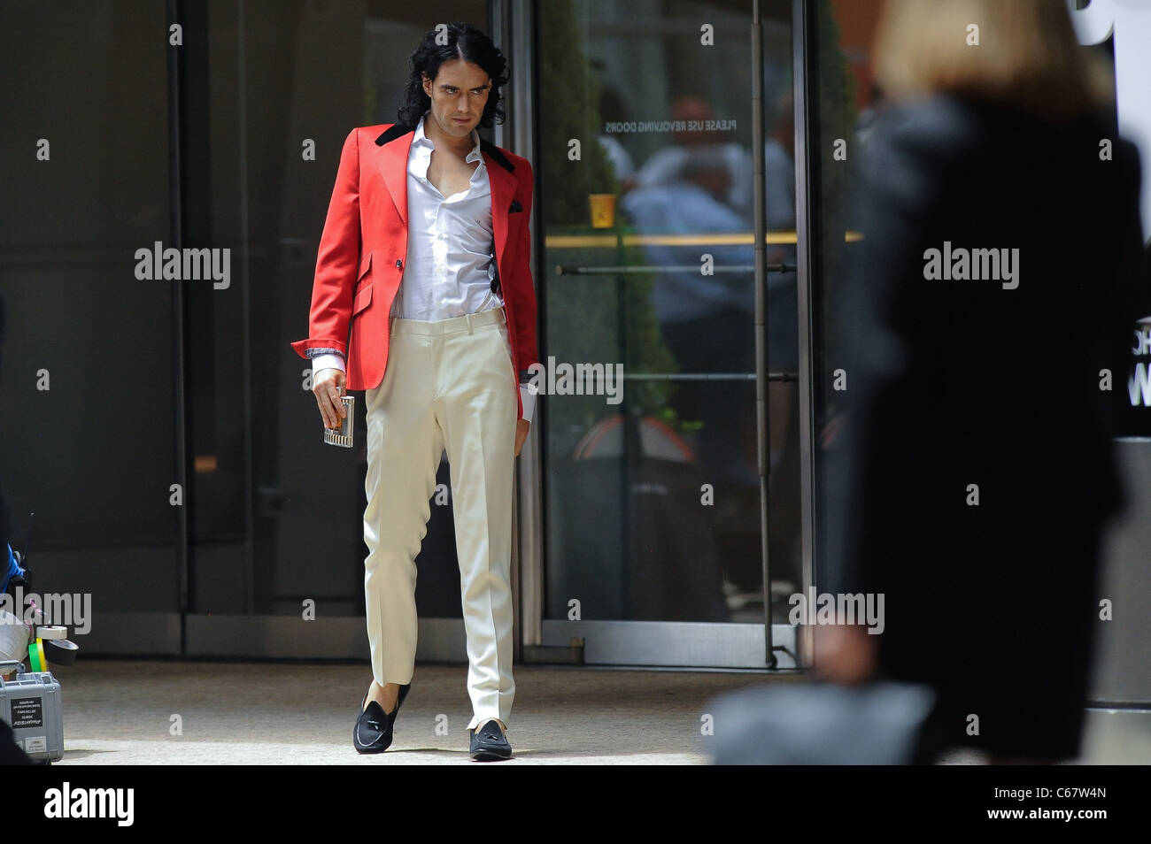 Russell Brand, films a scene at the 'Arthur' film set at the Bloomberg ...