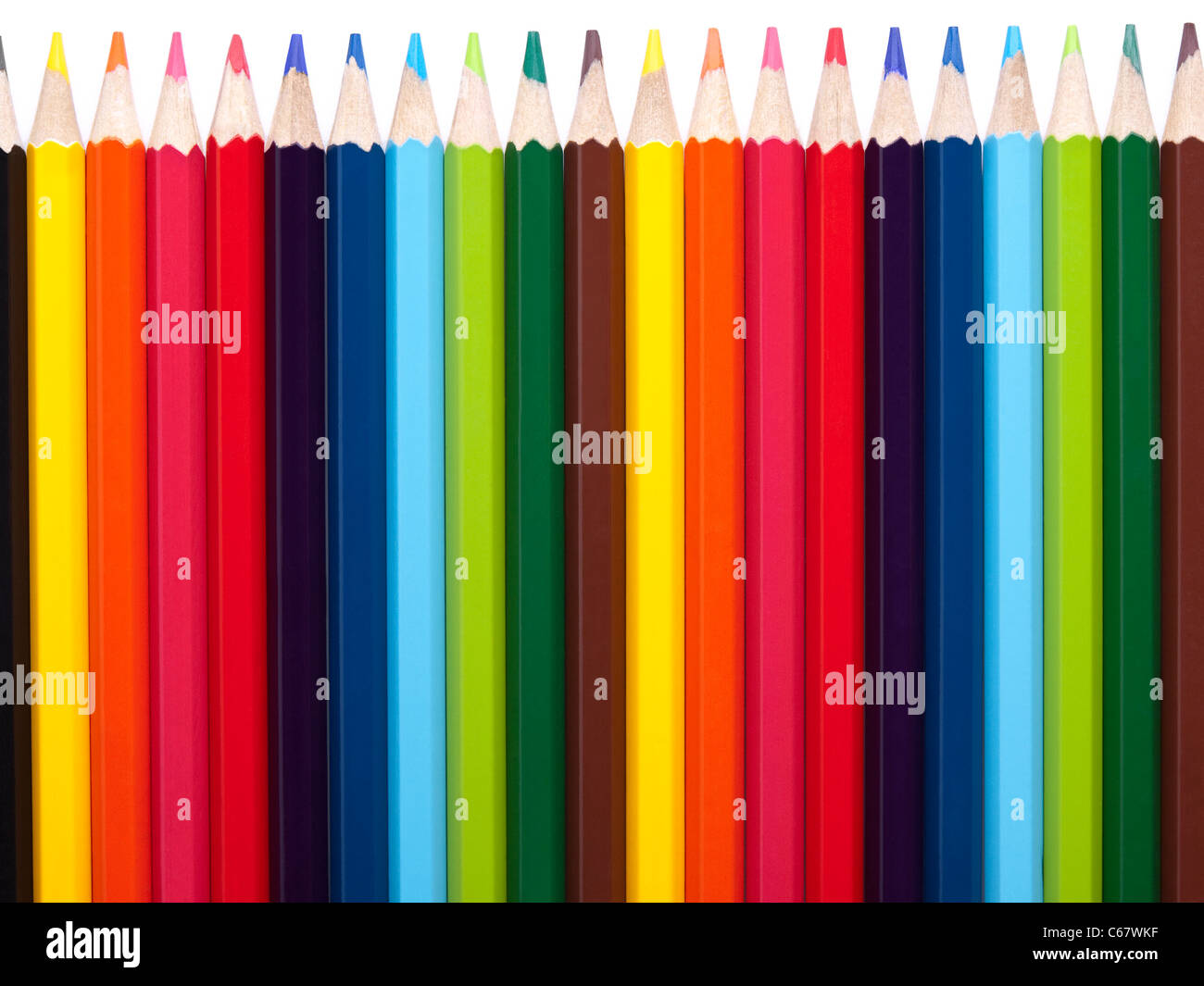 Several colored pencils in a straight row Stock Photo - Alamy