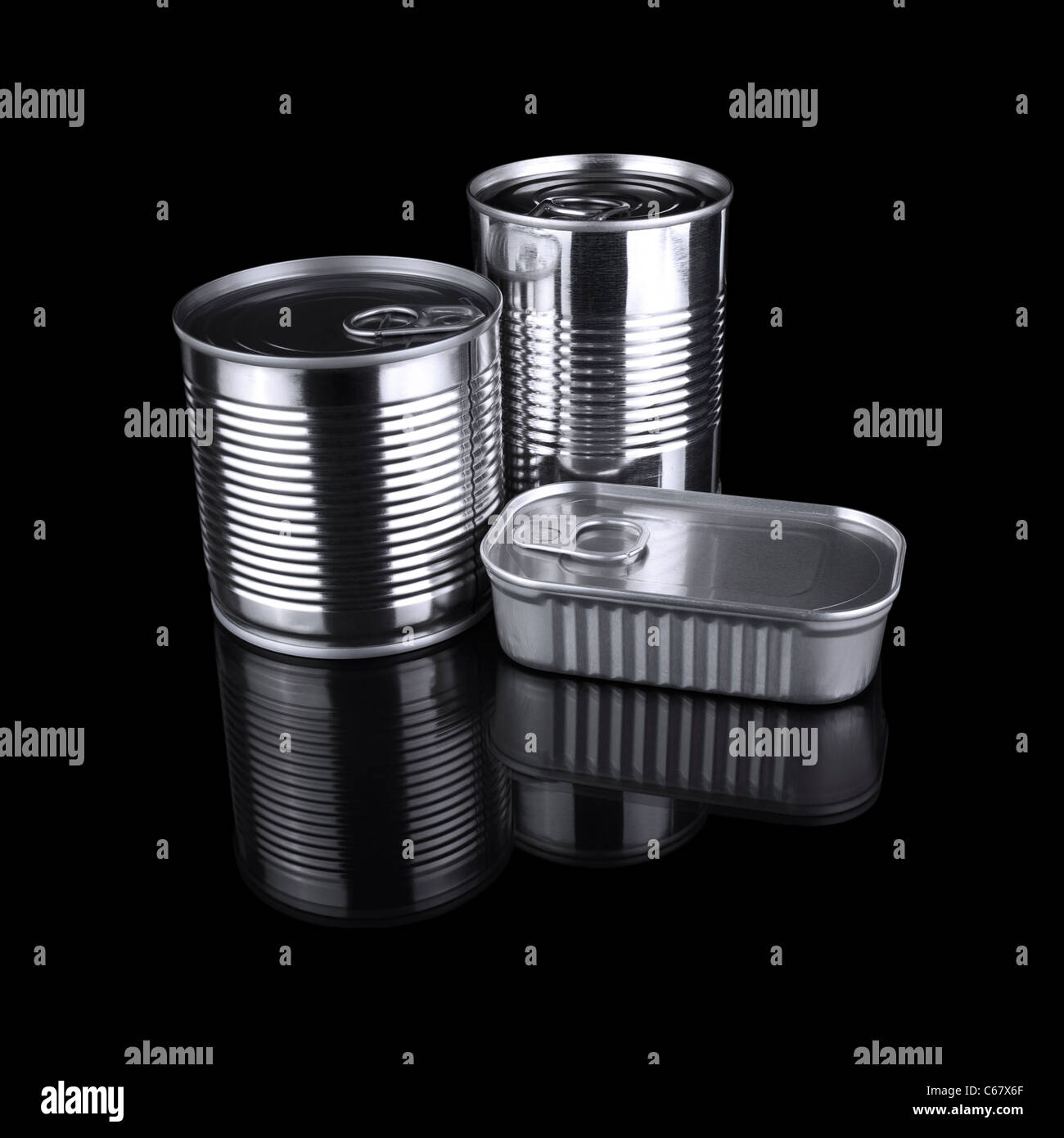 Three different tin cans isolated over a black background Stock Photo ...