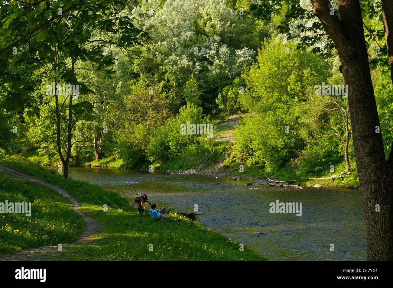 A man relaxes at the Vilnia river - Vilinius, Lithuania Stock Photo - Alamy