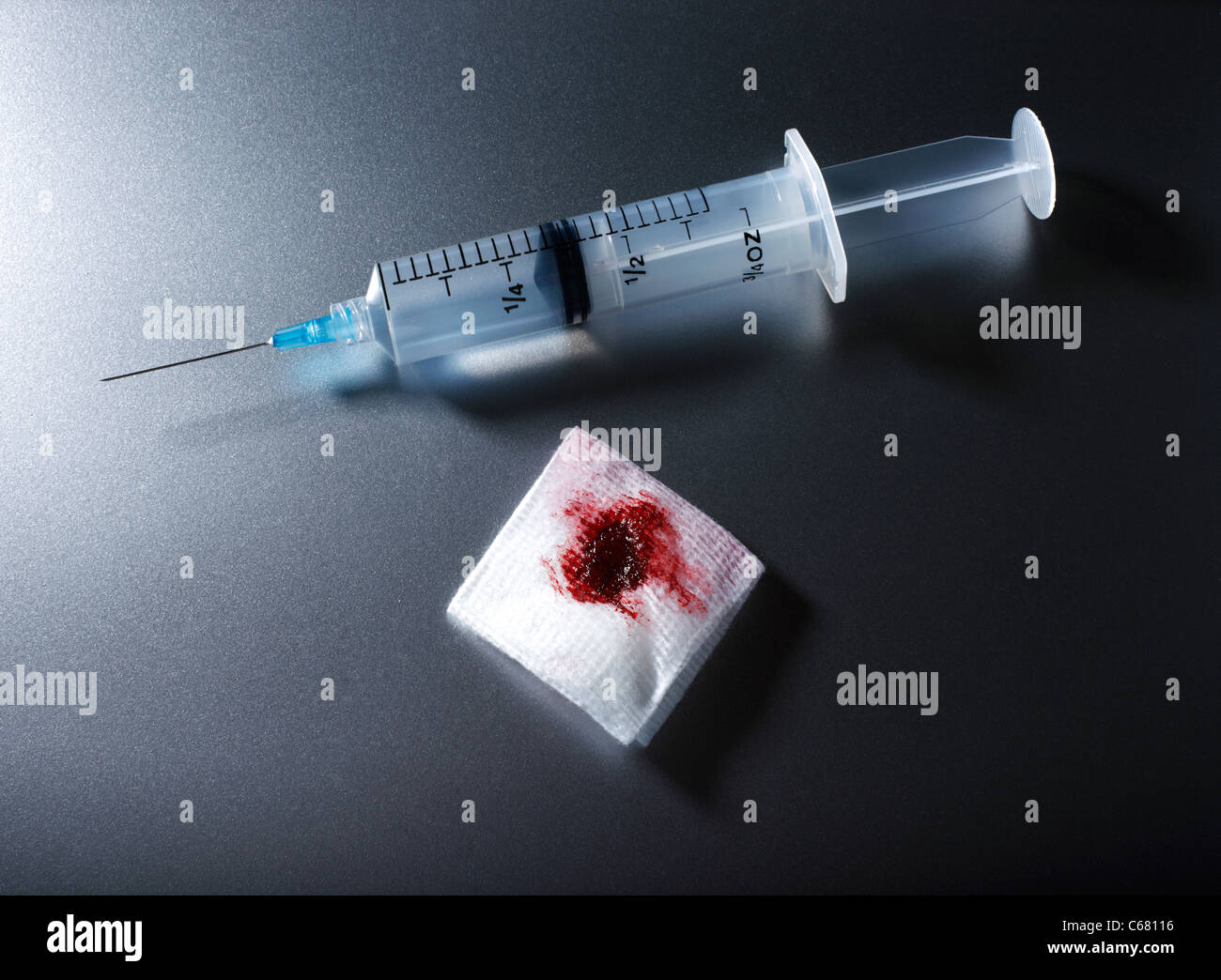Syringe bloody hypodermic needle hi-res stock photography and images ...