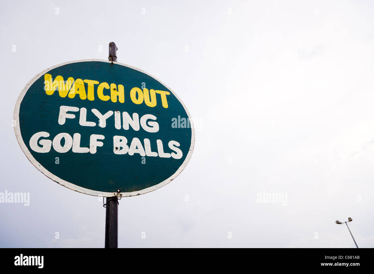 handwritten sign in golf field, warning of flying golf balls Stock ...