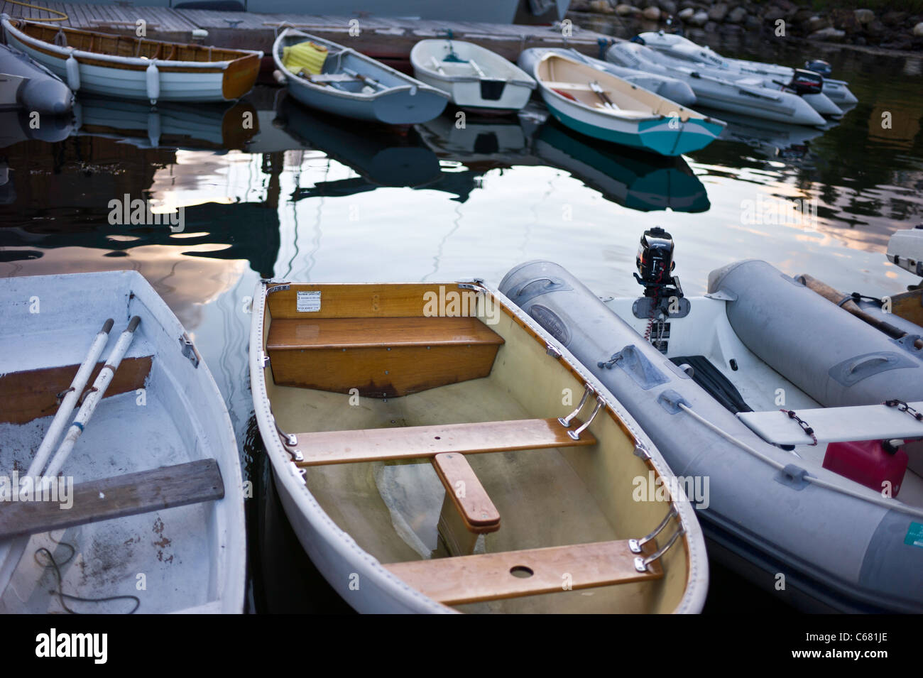 Rowboats tied up to docks Stock Photo - Alamy