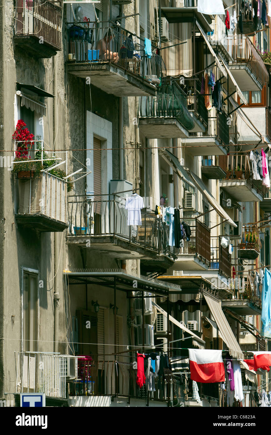 Apartment and home balconies in narrow road between very old and ...