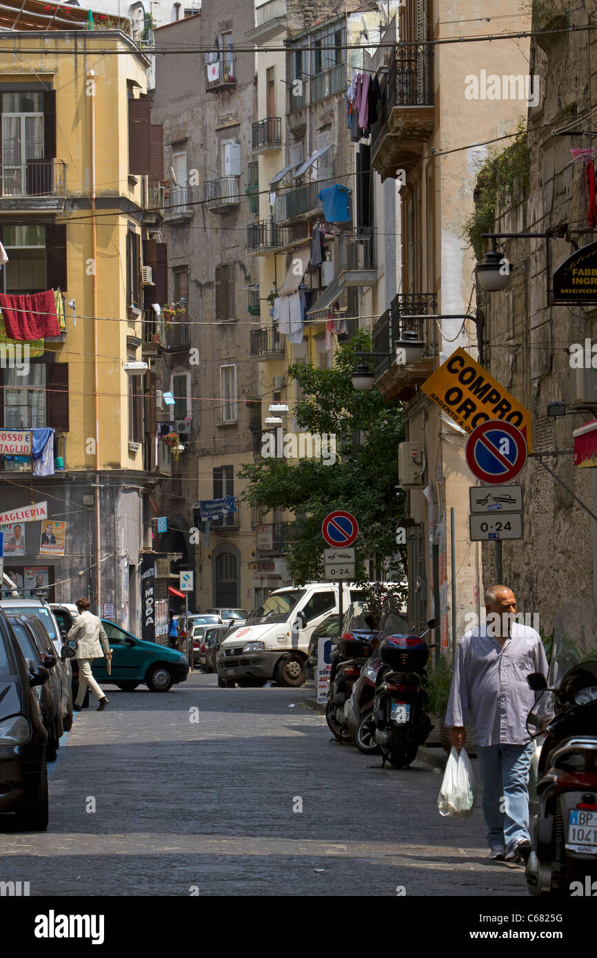 Naples Italy narrow road between high rise apartments, houses and ...