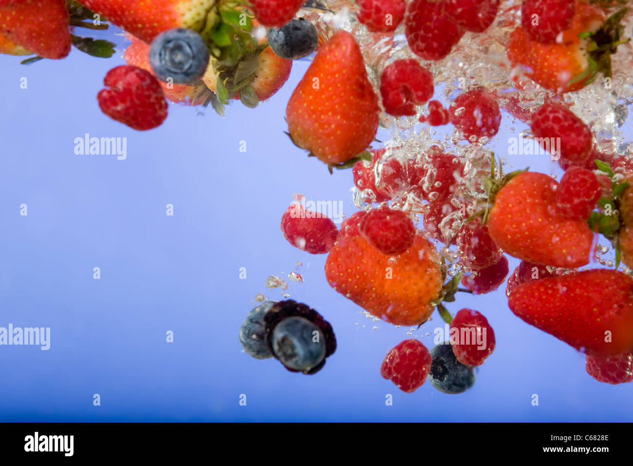 Fruit splashing in water background - shallow depth of field Stock ...