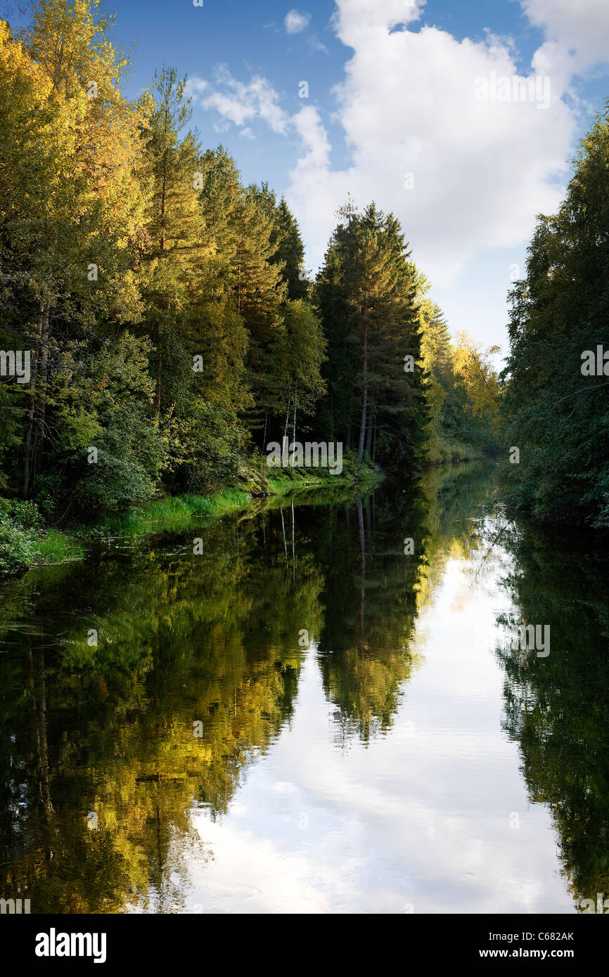 A quiet stream surrounded by beautiful fall colors Stock Photo - Alamy