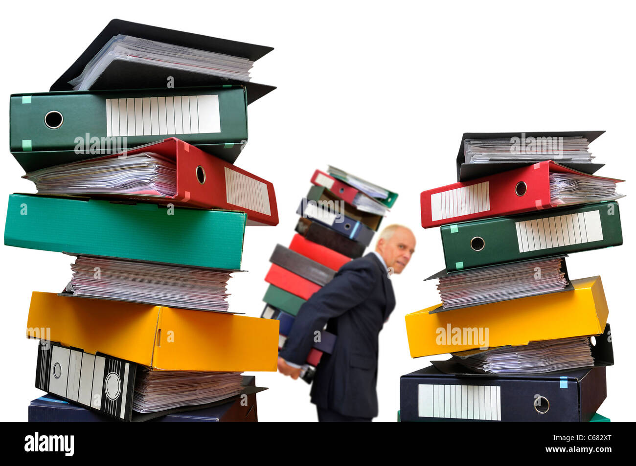 Worker with stack of files isolated in white Stock Photo - Alamy