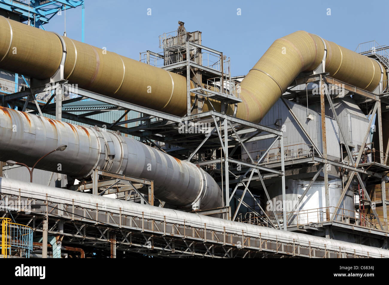 Industrial pipes on a factory and blue sky Stock Photo - Alamy