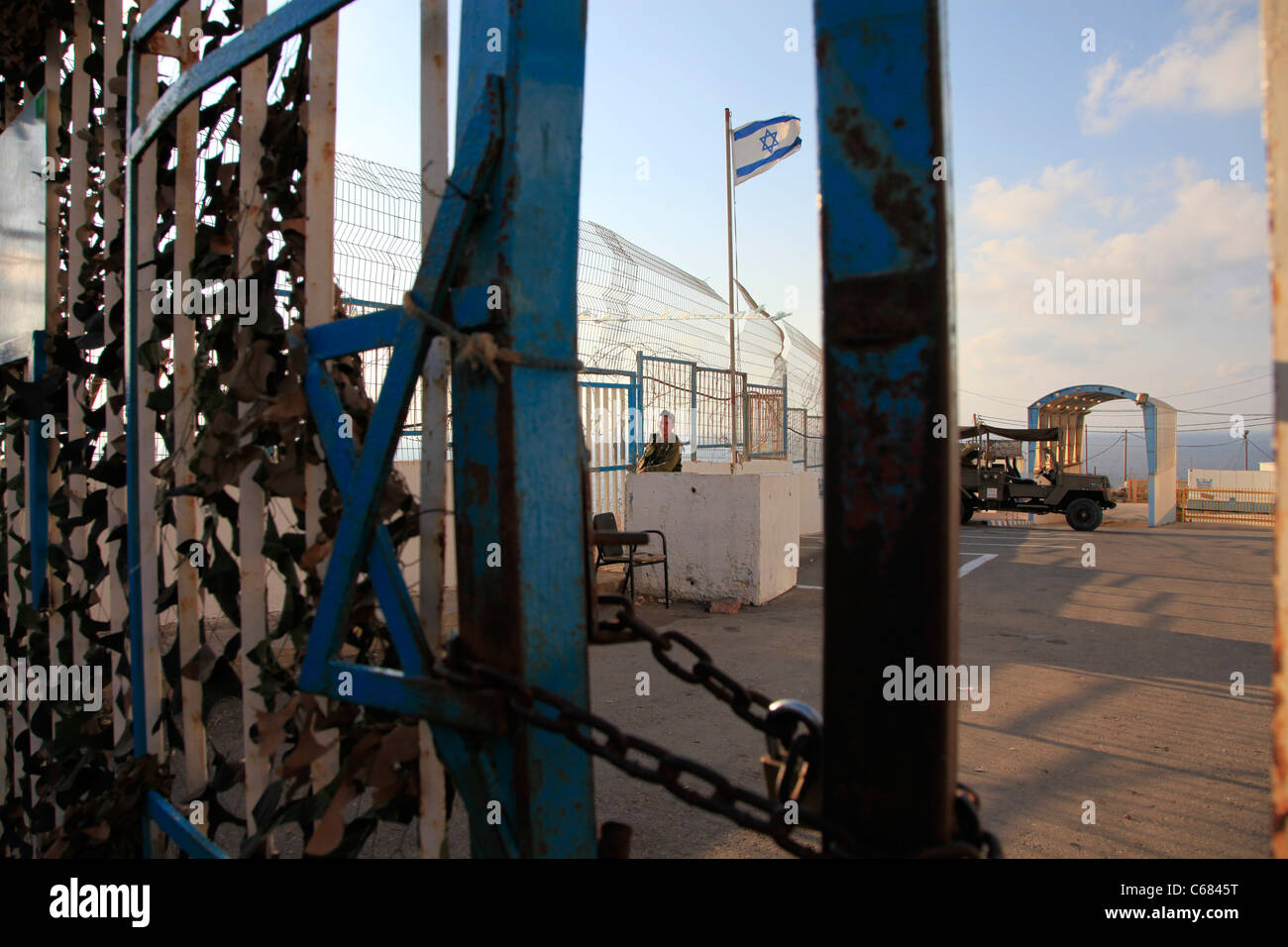 An Israeli soldier stands guard at the gate of the Rosh Hanikra ...
