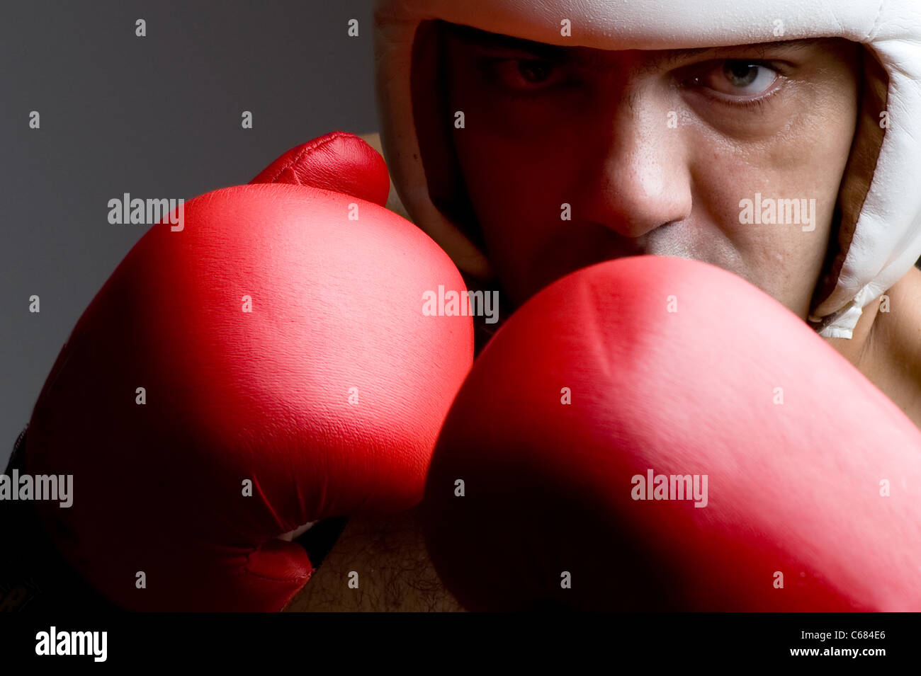 boxer in protective helmet and boxing gloves Stock Photo - Alamy