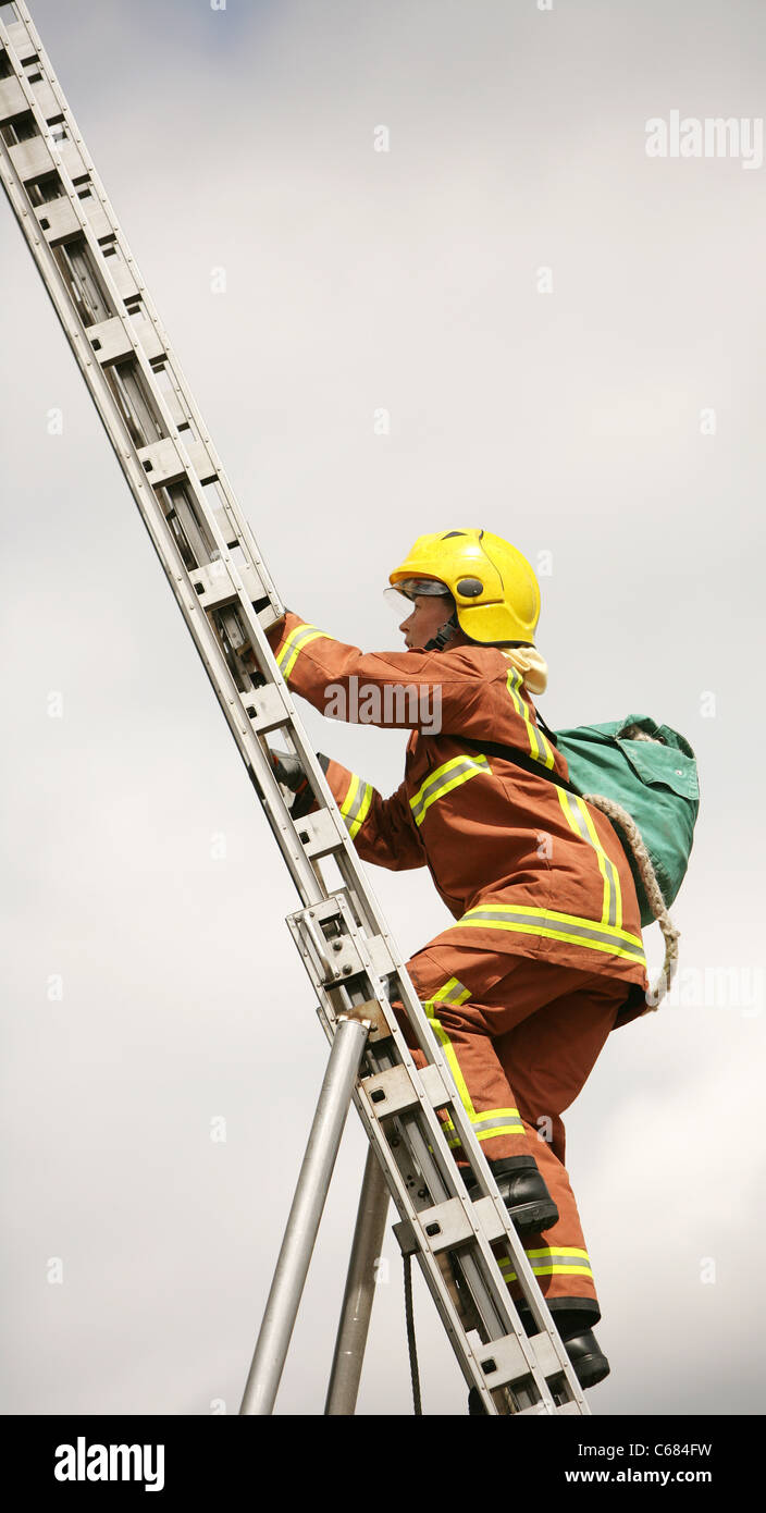 Fireman climbing ladder hi-res stock photography and images - Alamy