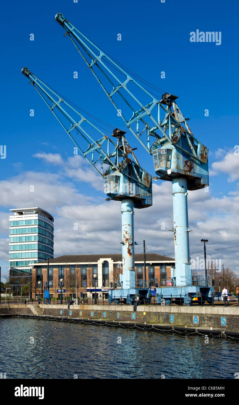 Old dockyard cranes positioned within the new modern development at ...