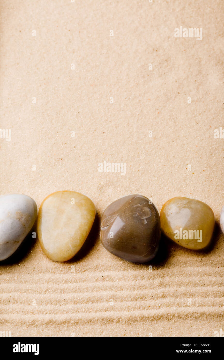 A sand beach abstract background with rocks Stock Photo - Alamy