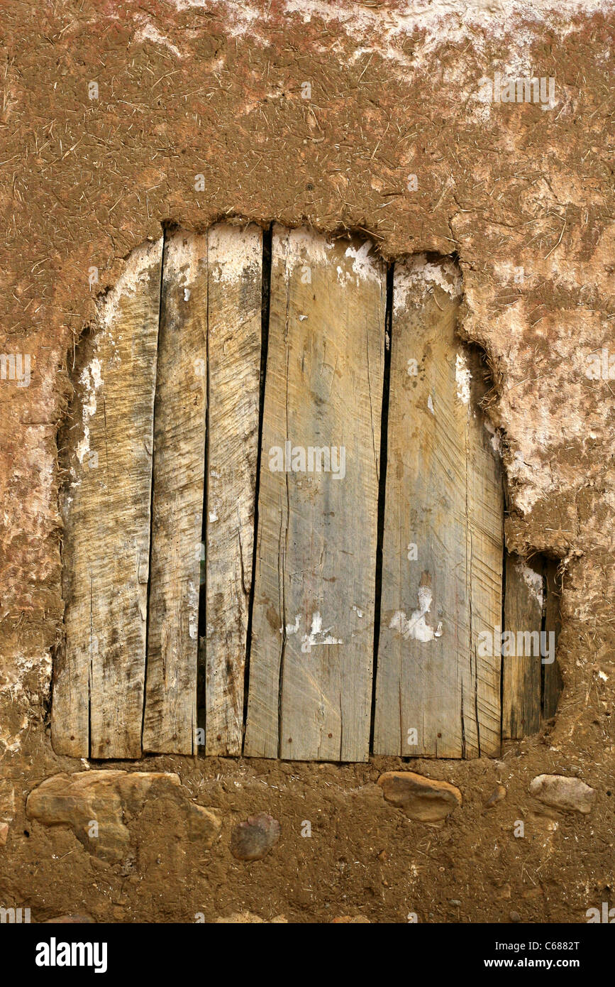 Rustic window in a house constructed from adobe bricks in Cajamarca ...