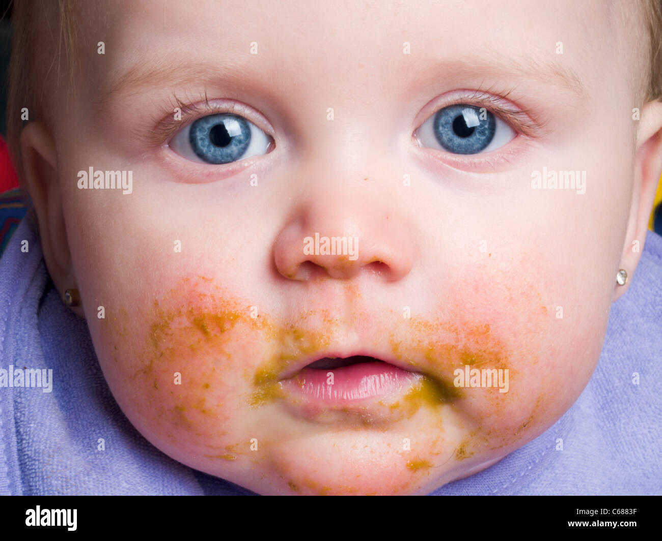 Baby Face with baby food on face Stock Photo - Alamy