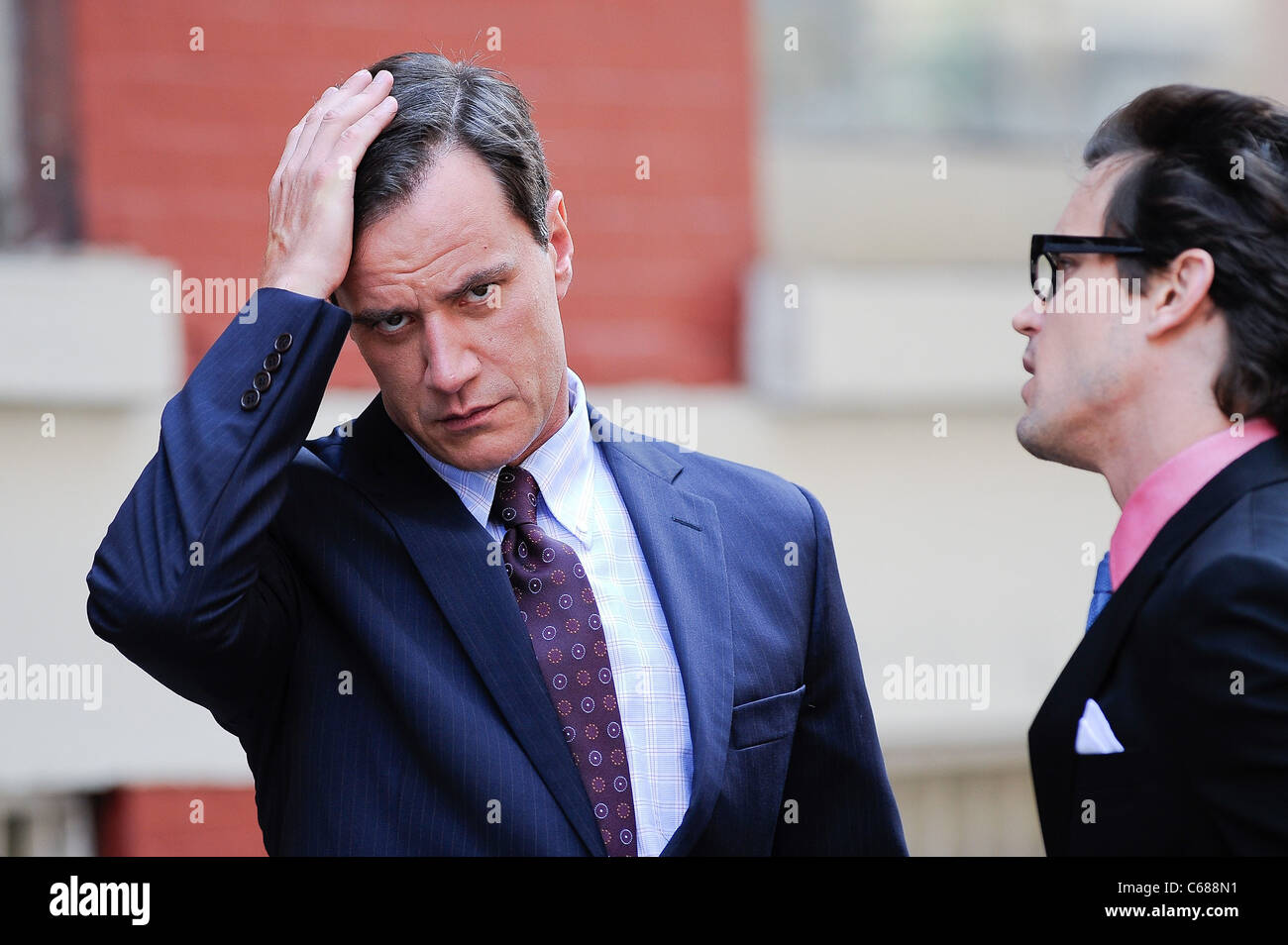 Tim DeKay, Matthew Bomer, film a scene at the 'White Collar' movie set ...