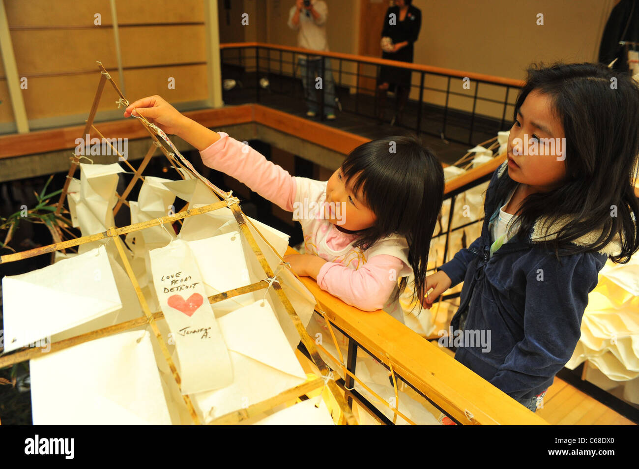 Sisters cindy toda alisa toda hang wishes on prayer lanterns hi-res ...