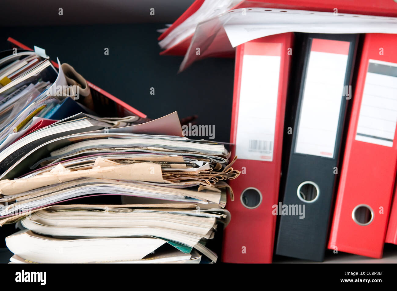 Messy case with a stack of documents Stock Photo - Alamy