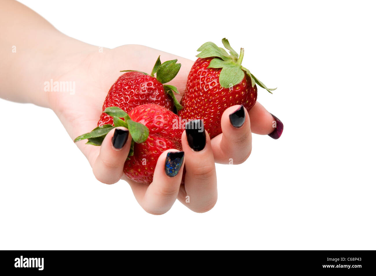 Strawberry in a female hand, it is isolated on a white background Stock ...
