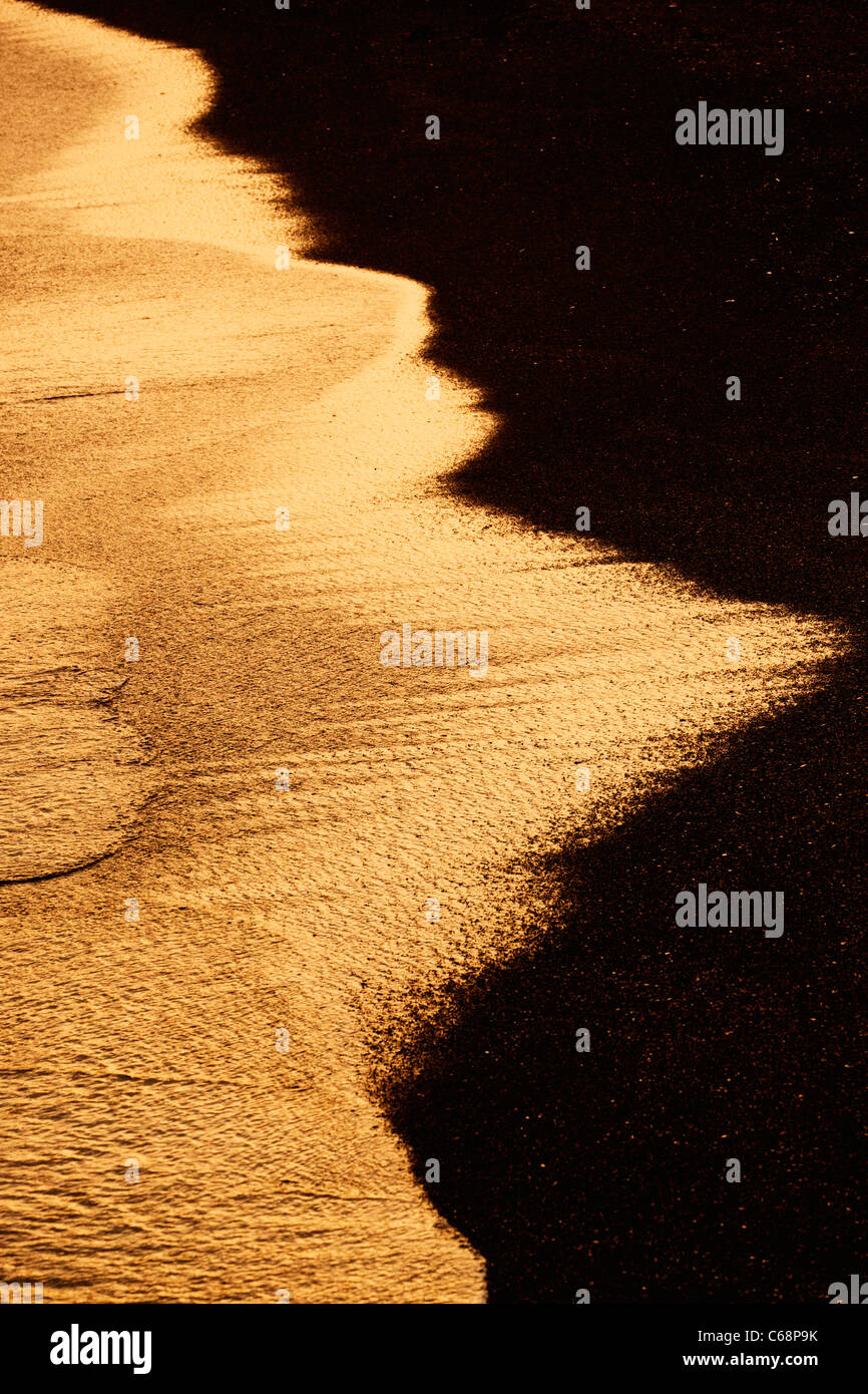 Waves breaking on beach Stock Photo - Alamy