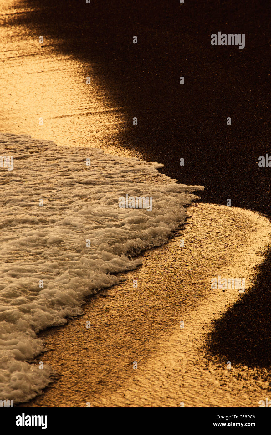 Waves breaking on beach Stock Photo - Alamy